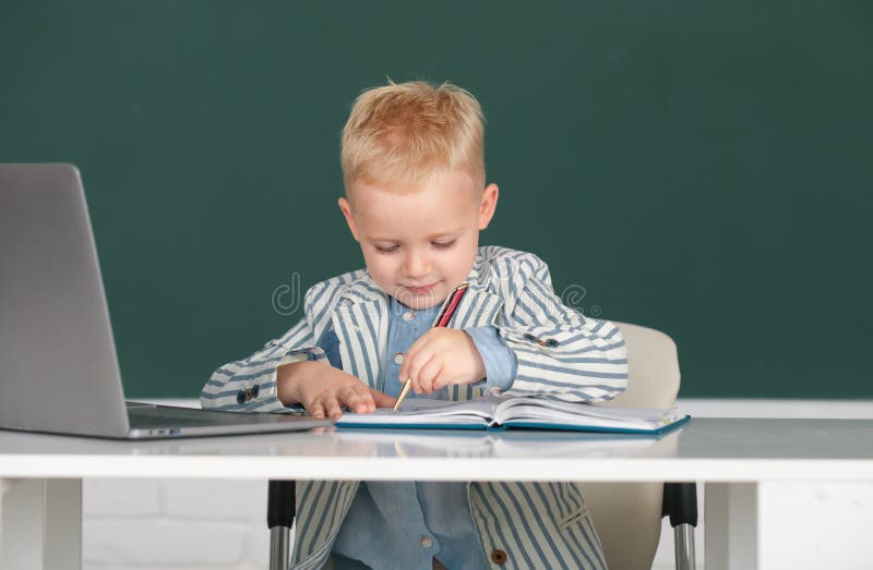 Little Student Child Studying in Classroom at Elementary School. Kid ...