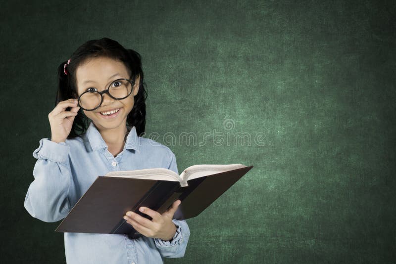Little Student Holding Textbook Stock Photo - Image of girl, cute: 97003874