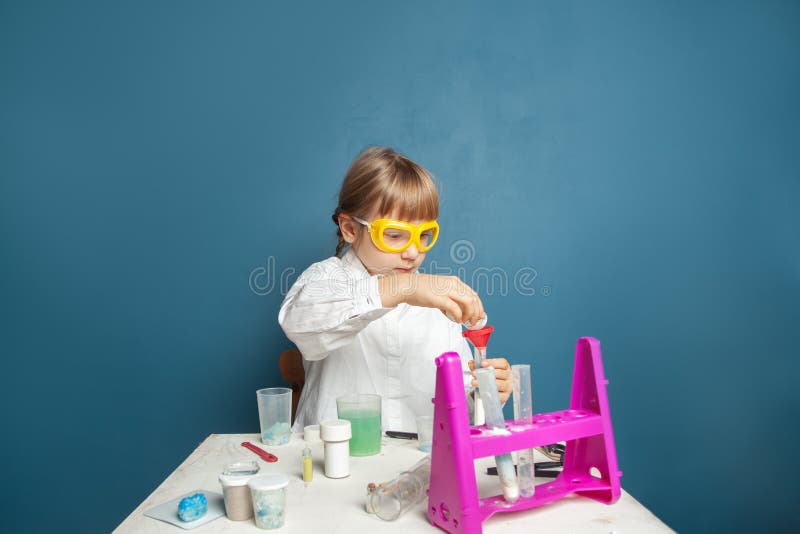 Little Student is Wearing Uniform and Glasses with Science Experiment ...