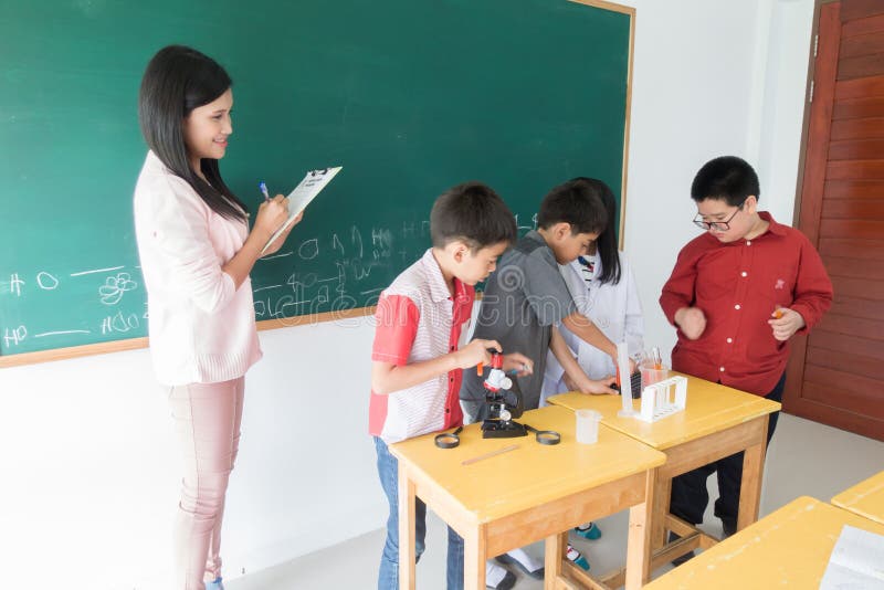 Little Students Study Science in Classroom Stock Image - Image of asian ...