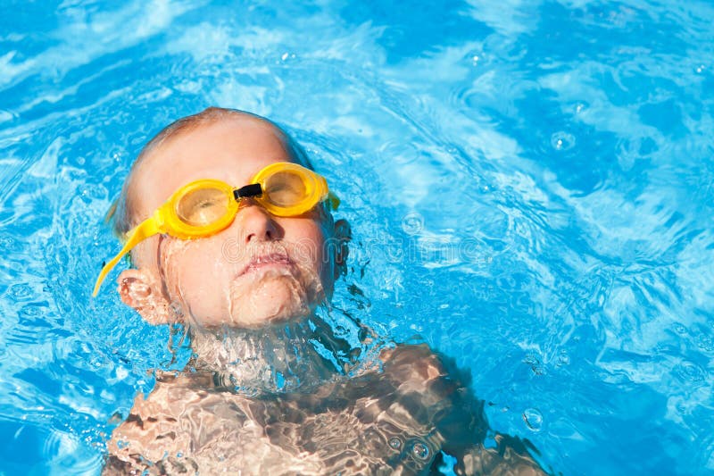 Boy swims on his back stock image. Image of refreshing - 62727725