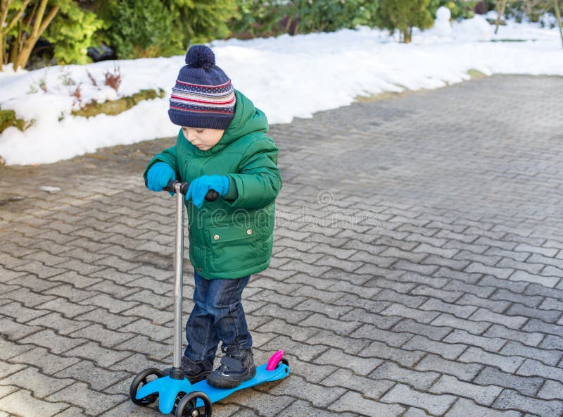 Little Toddler Boy Learning To Drive Scooter Stock Photos - Free ...