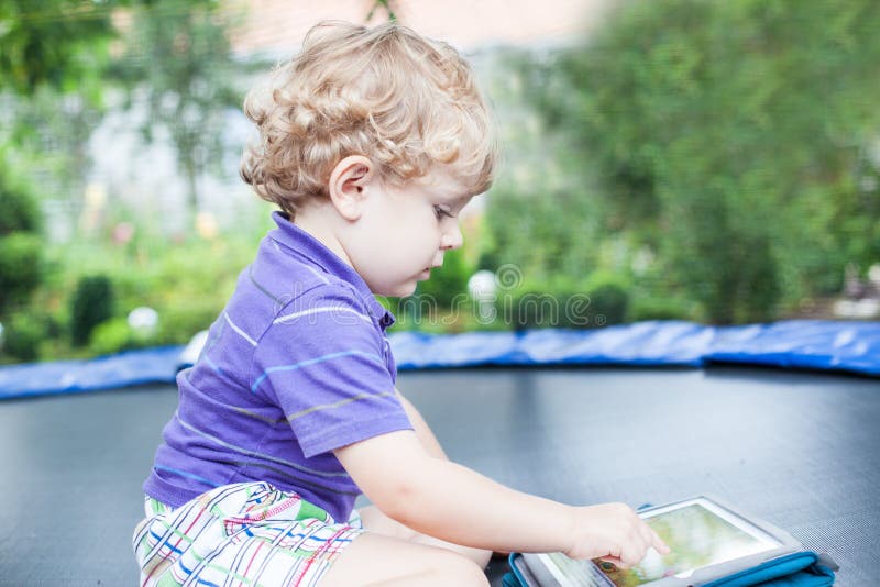 Little Toddler Boy Playing with Tablet Pc Outdoors Stock Image - Image ...