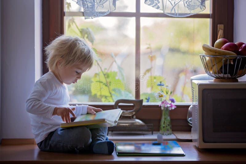 Little Toddler Boy, Reading Book in Kitchen Stock Image - Image of ...