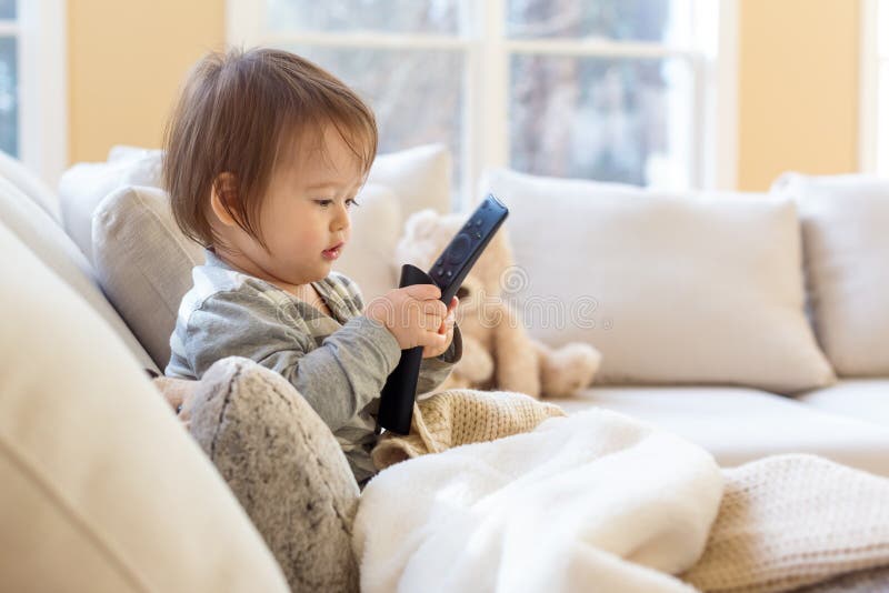 Toddler Boy with a TV Remote Control Stock Photo - Image of little ...