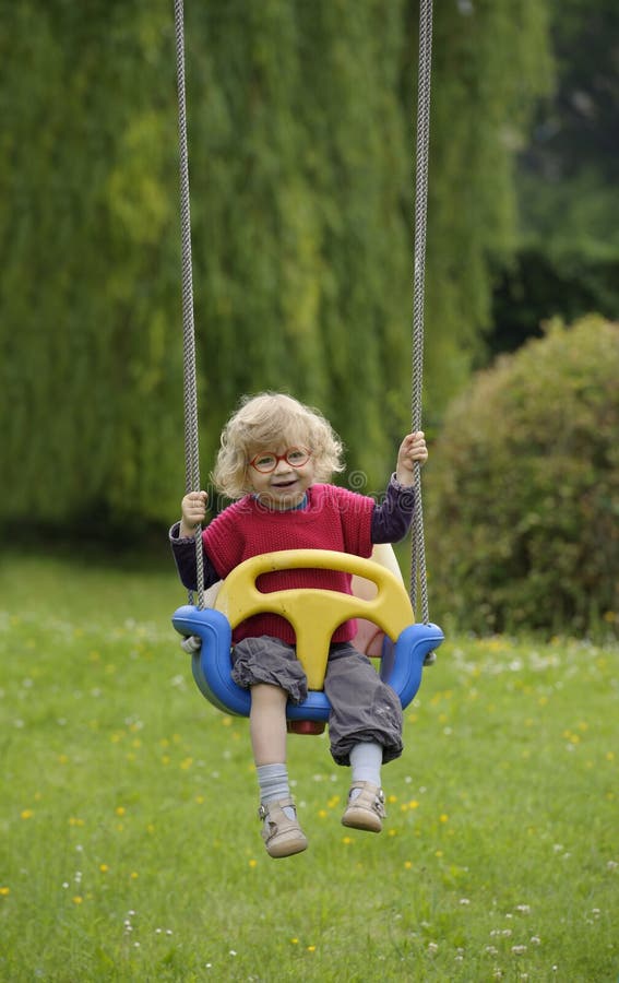 Little toddler on a swing stock photo. Image of little - 41453854