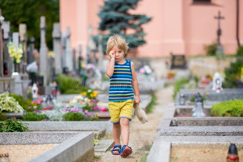 Little Toddlet Boy, Sitting on a Cemetery, Feeling Sad Stock Photo ...