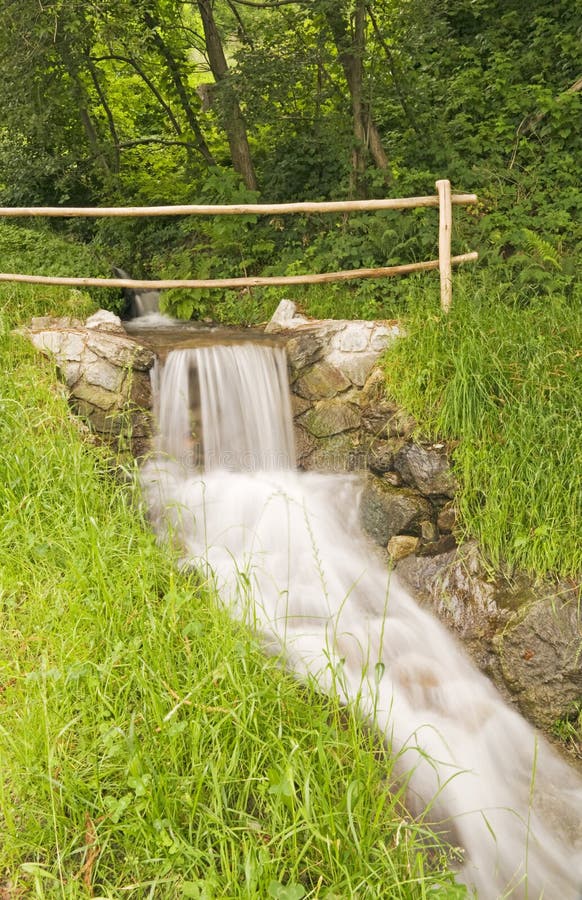 Little waterfall by bridge stock image. Image of exposure - 7096187