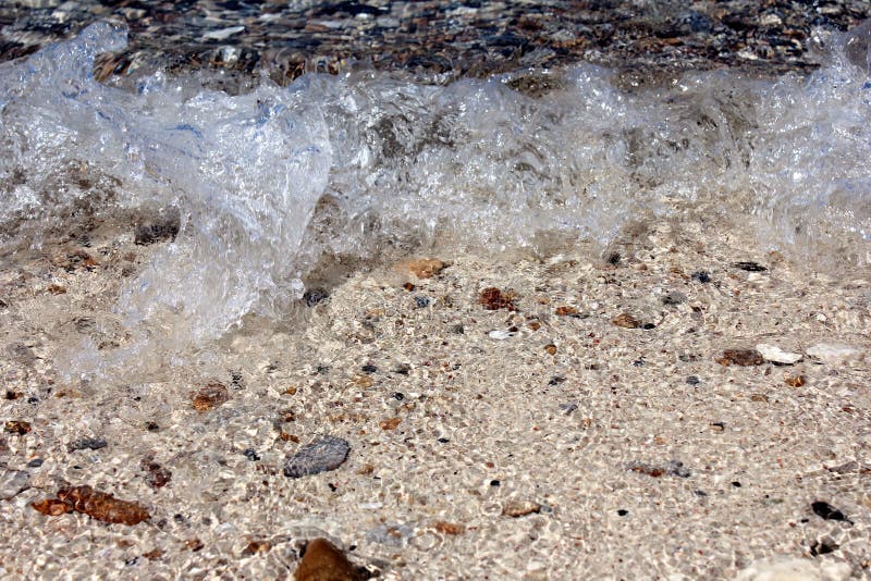 Little wave on the beach stock photo. Image of green - 87450806