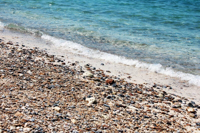 Little wave on the beach stock photo. Image of white - 87451636