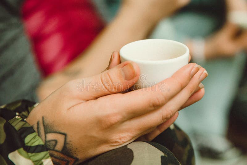 Little White Cup with Green Tea in the Hand of a Woman. Stock Image ...