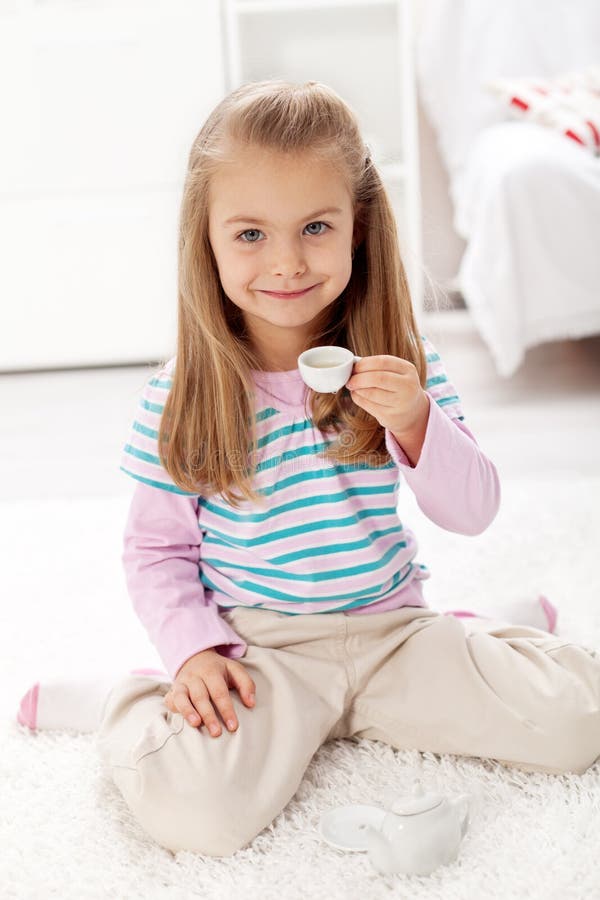 Littlle girl having tea stock image. Image of beautiful - 22312789