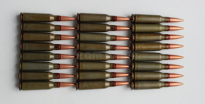 Live Ammunition Caliber 5.45 Laid Out Six in a Rows on a White Surface ...