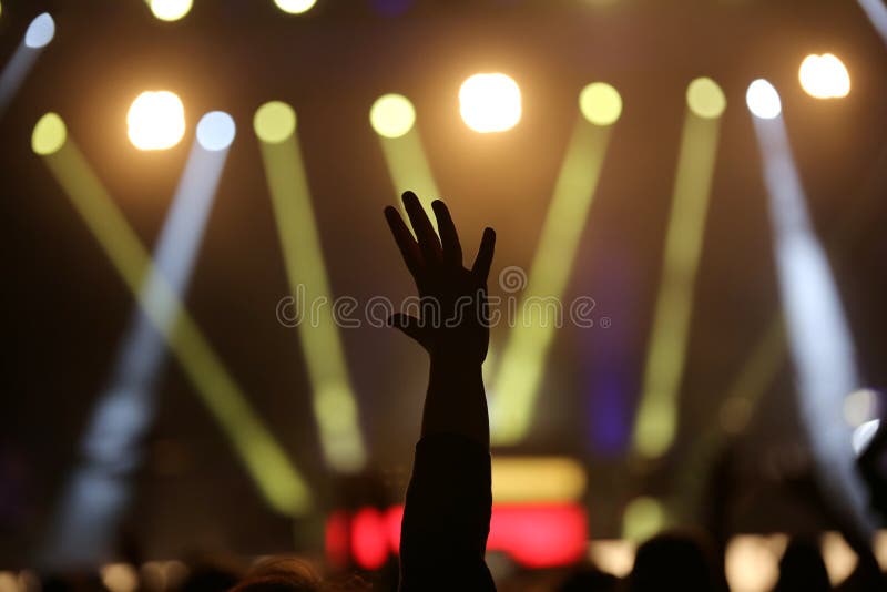 Hand Raised during the Performance of a Musical Ensemble at Live Stock ...