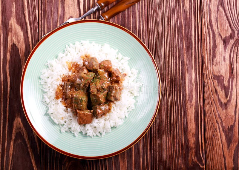 Liver in gravy with rice stock photo. Image of savory - 113937656