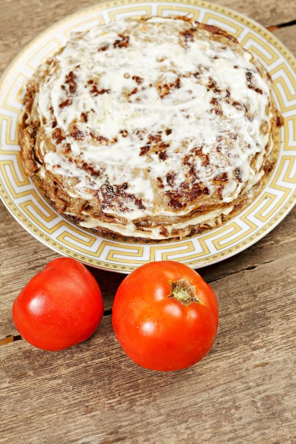Liver Pie with Tomatoes Above View Stock Image - Image of vertical ...