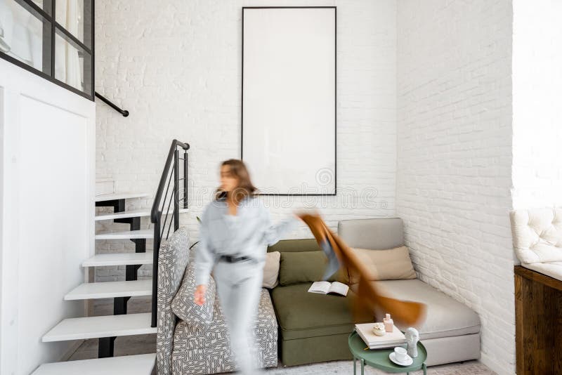 Living Room with Blurred Human Figure Stock Photo - Image of sofa ...