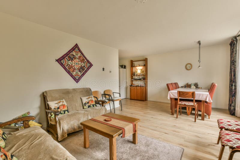 A Living Room with a Couch and a Dining Table Stock Image - Image of ...
