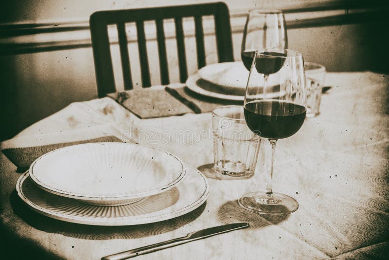 Living Room with Dining Table with Silverware and Red Wine Glasses in a ...