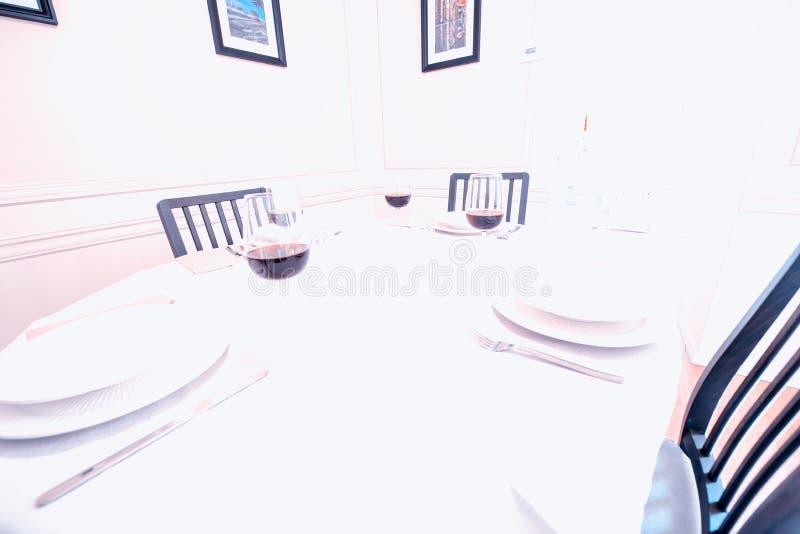 Living Room with Dining Table with Silverware and Red Wine Glasses in a ...