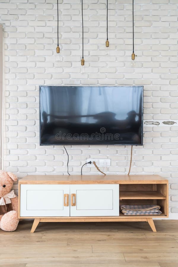 Living Room with Led Tv on Brick Wall and Wooden Table Stock Image ...