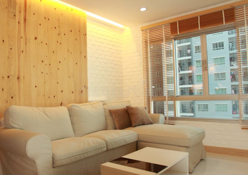 Living Room with Light Wood Panel and Hidden Lighting Stock Photo ...