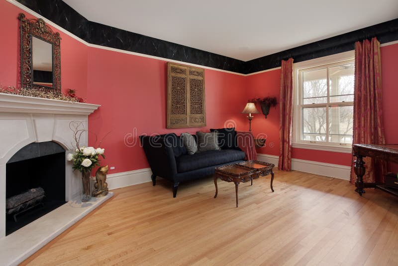 Living room with red walls stock image. Image of furnishings - 26083765