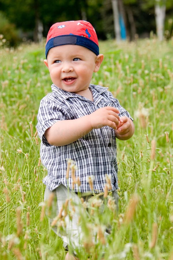 Llittle Boy on Green Summer Meadow Stock Photo - Image of field ...