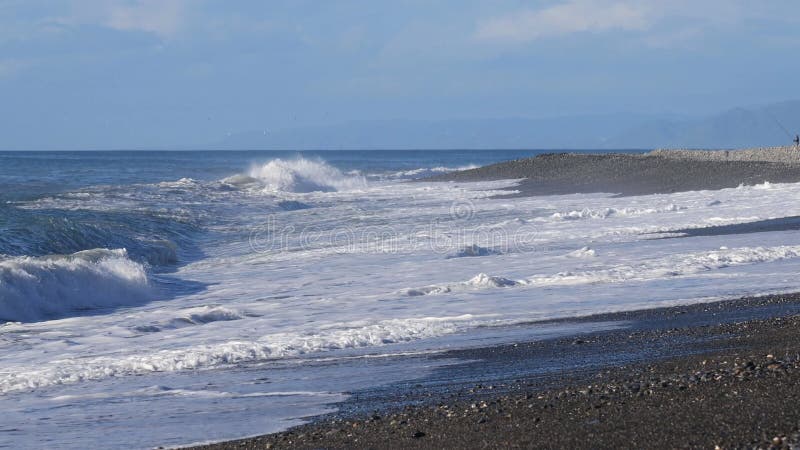 In Arc Beach in Front of the Eyes, the Continuous Rolling Waves. Stock ...