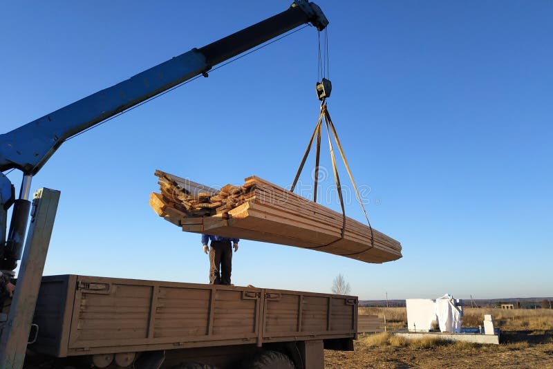 Load Boards Supplied To the Construction Site with a Crane, Manipulator ...