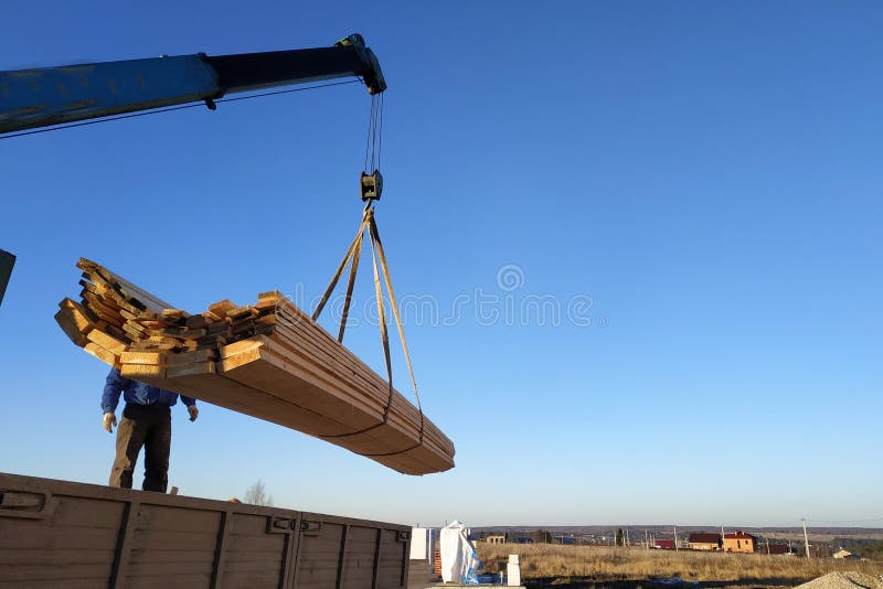 Load Boards Supplied To the Construction Site with a Crane, Manipulator ...