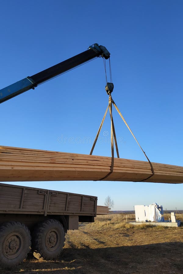 Load Boards Supplied To the Construction Site with a Crane, Manipulator ...