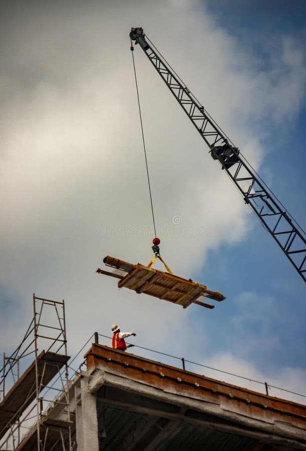 A Crane Being Used To Erect a Tower Crane.. Stock Image - Image of tall ...