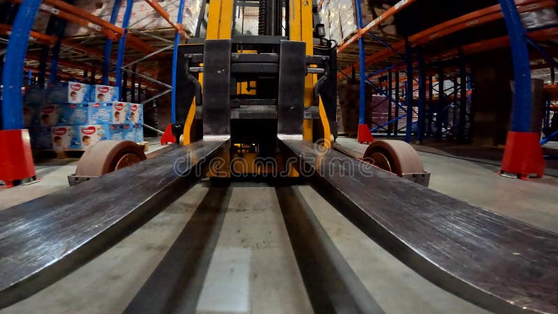 Forklift Fork Close-up. the Load Lifter Rides on the Warehouse Pov ...