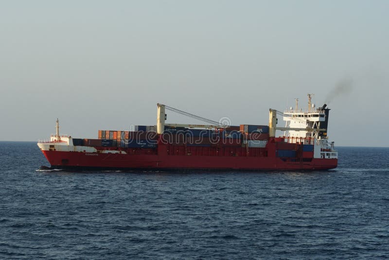 Loaded Container Vessel with Red Hull and Equipped with Two Cargo ... Loaded Container Vessel with Red Hull and Equipped with Two Cargo ...