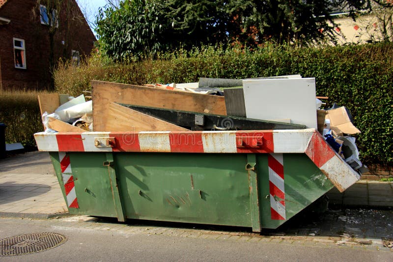 Loaded garbage dumpster stock photo. Image of hire, industrial - 221617866