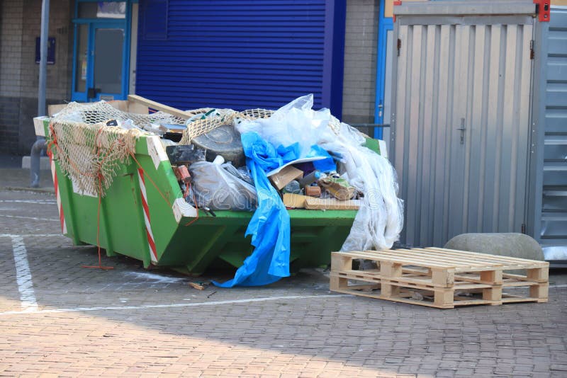 Loaded garbage dumpster stock image. Image of renovating - 244631735