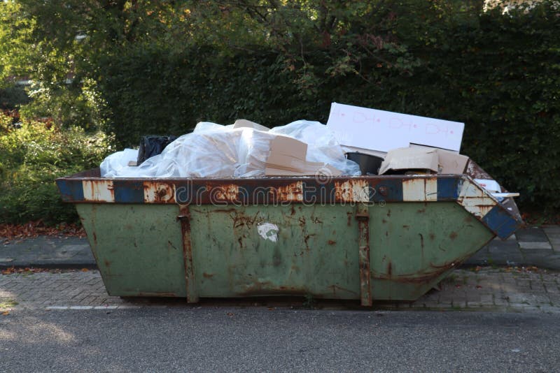 Loaded garbage dumpster stock image. Image of building - 147808481