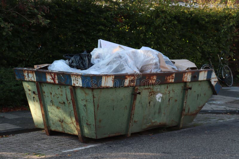 Loaded garbage dumpster stock image. Image of container - 155465239