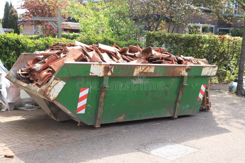 Loaded garbage dumpster stock photo. Image of hire, industrial - 221617866