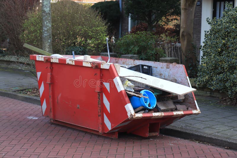Loaded garbage dumpster stock photo. Image of hire, industrial - 221617866