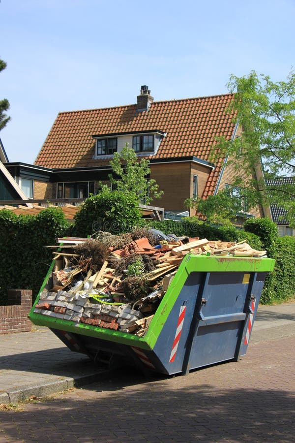 Loaded garbage dumpster stock photo. Image of hire, industrial - 221617866