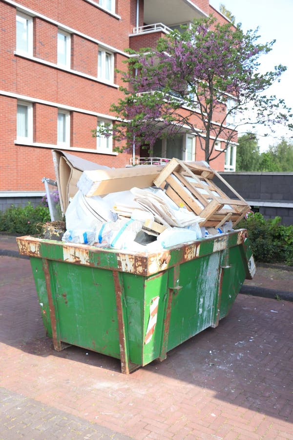 Loaded garbage dumpster stock photo. Image of hire, industrial - 221617866