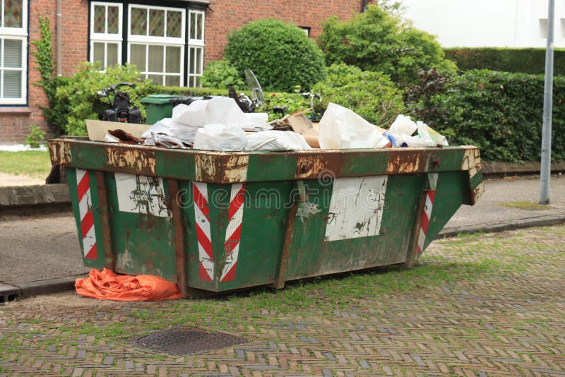 Loaded garbage dumpster stock photo. Image of hire, industrial - 221617866