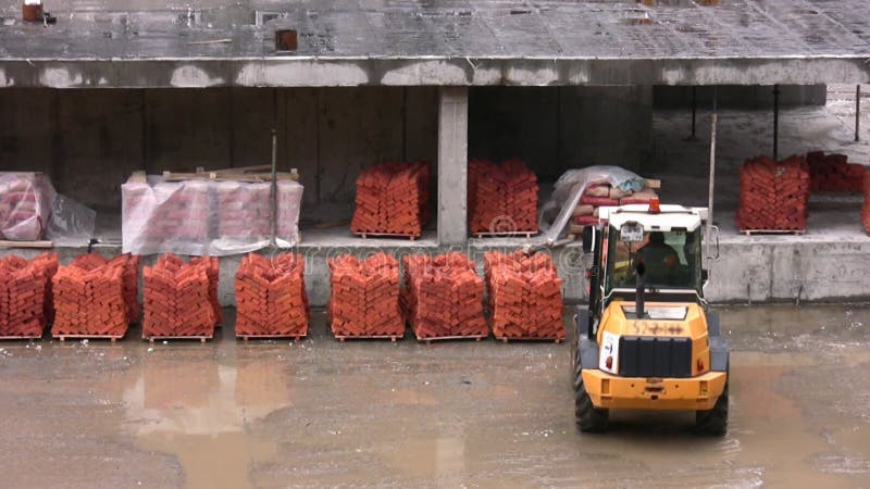 Loader carry the bricks in stock footage. Video of driving - 321009748