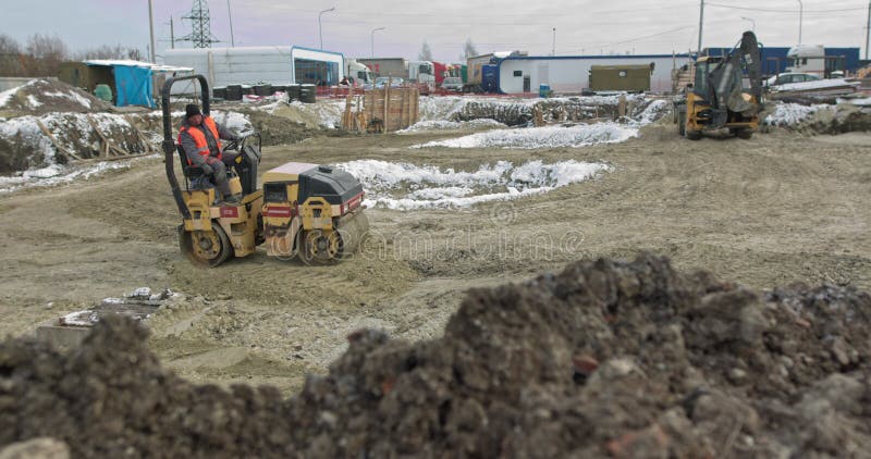 Loader Excavator, Bulldozer and Roller Work on Construction Site ...