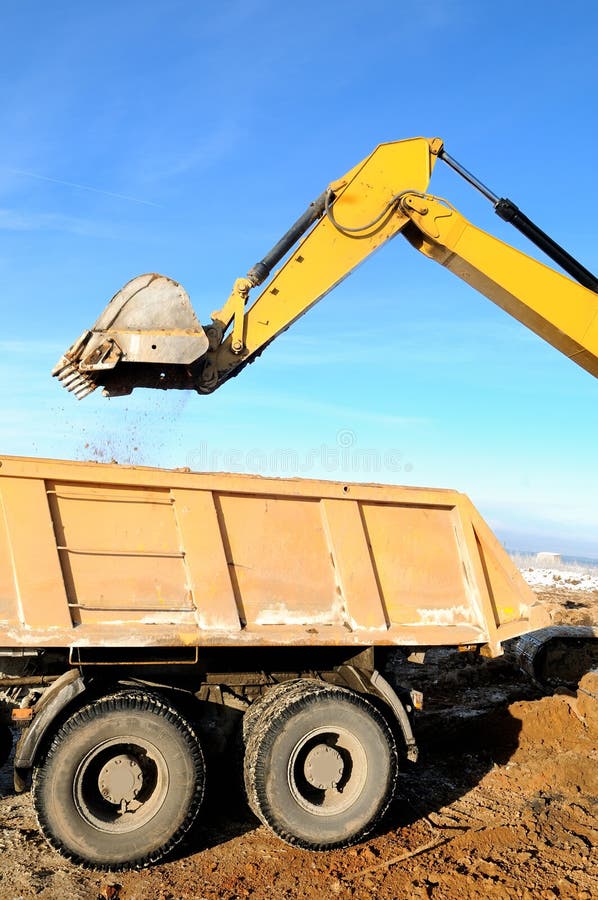 Excavator and Rear-end Tipper Stock Photo - Image of industry, digger ...