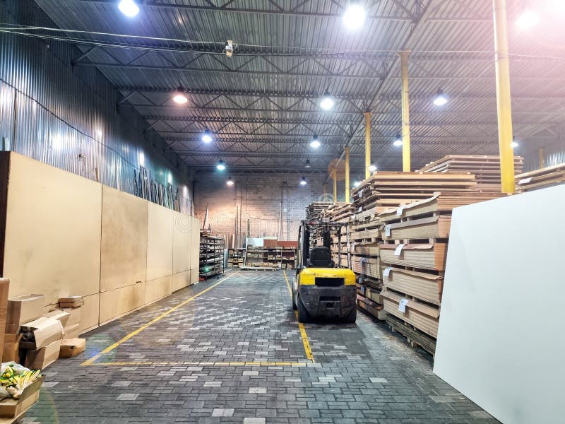 Loader in a Hardware Store in a Chipboard Warehouse. Stock Photo ...