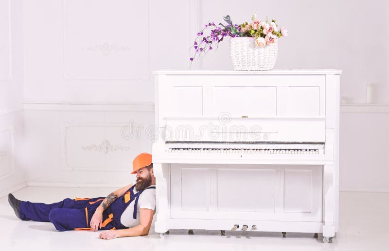 Loader Lean on Piano Instrument. Lazy Worker Concept Stock Photo ...