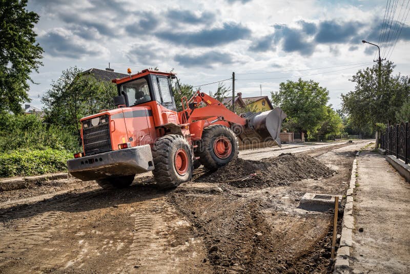 The Loader is Leveling the Foundation for the New Road Stock Image ...
